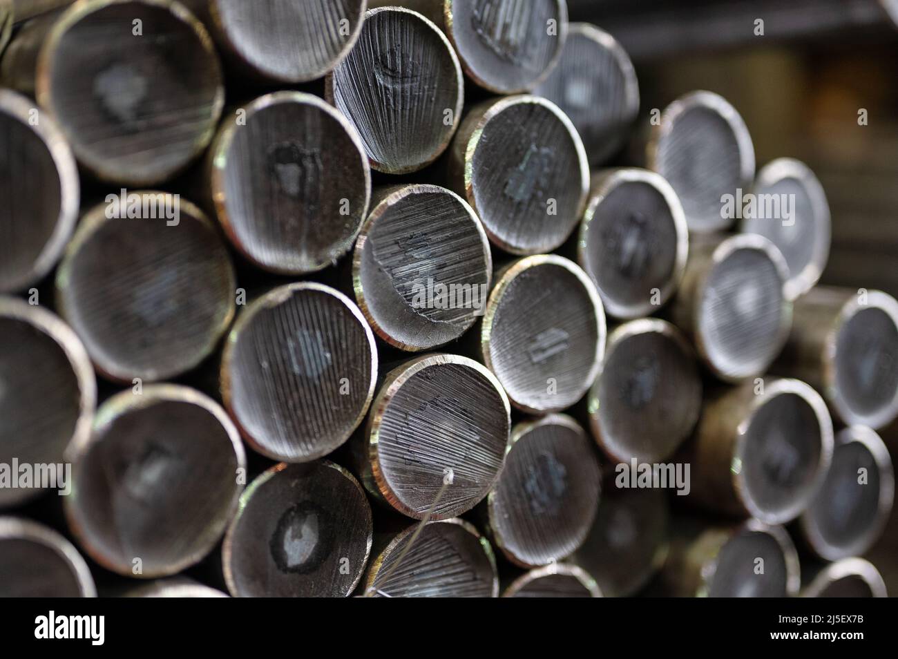 A bundle of round metal bars, steel mill products Stock Photo - Alamy