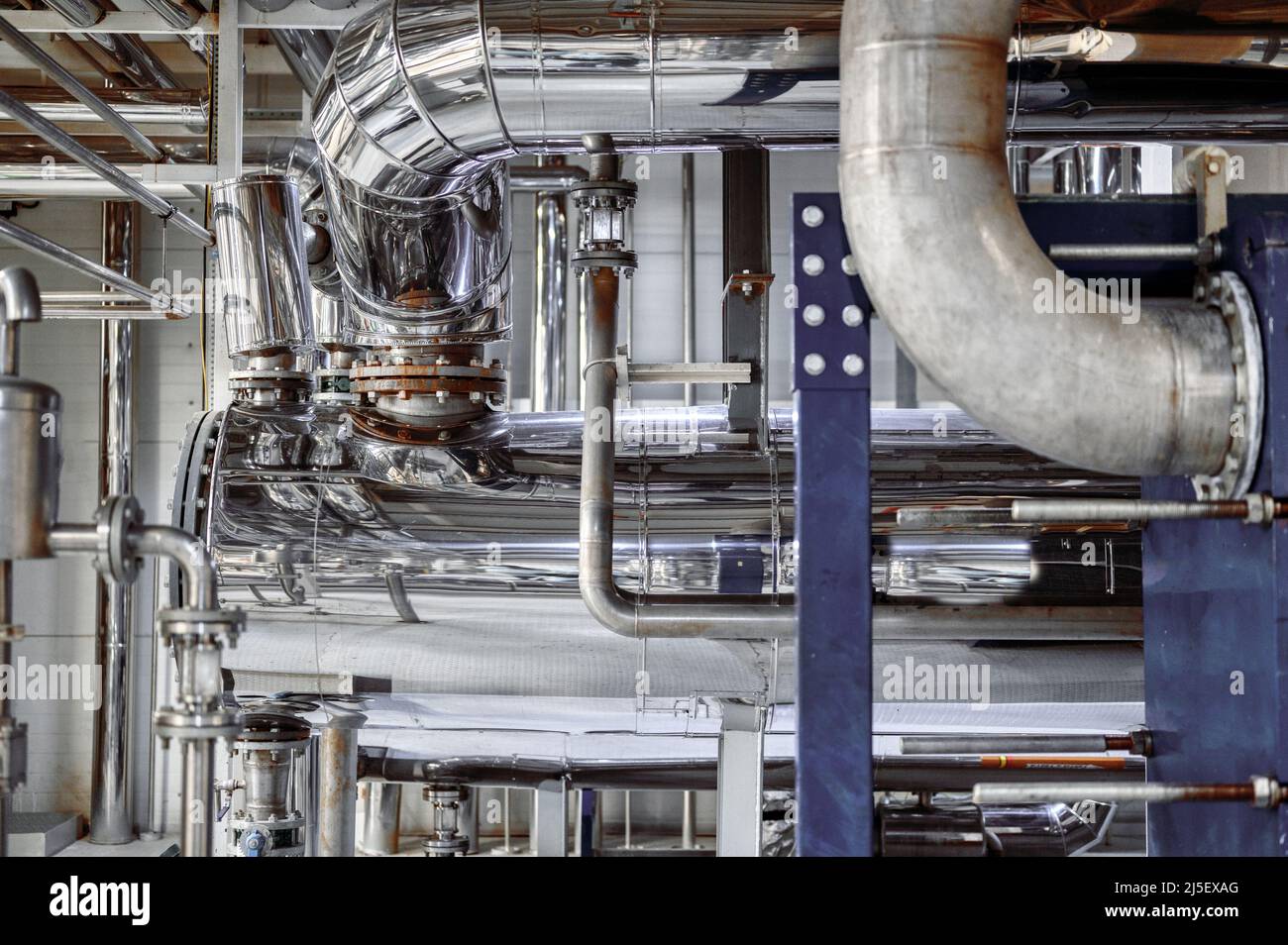 Cylindrical tank and pipeline system at production factory Stock Photo ...