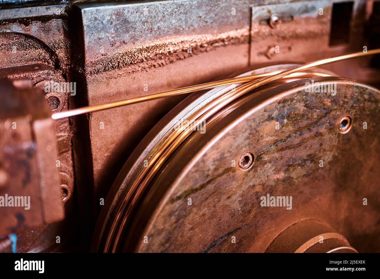 Copper wire straightener machine tool in plant workshop Stock Photo - Alamy