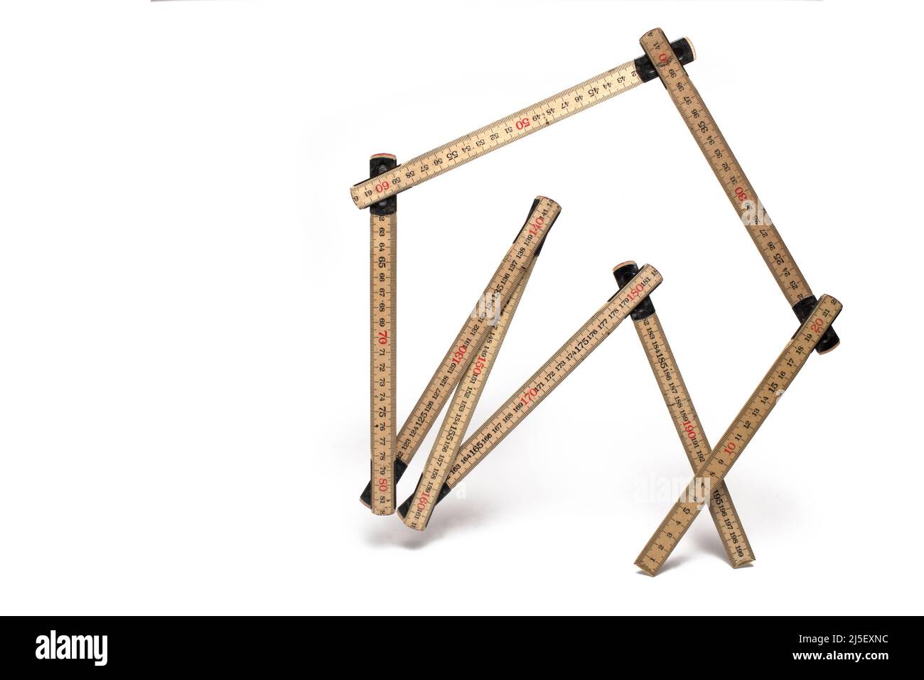 Close up wide open and a wooden meter stick folding rule with fully ...