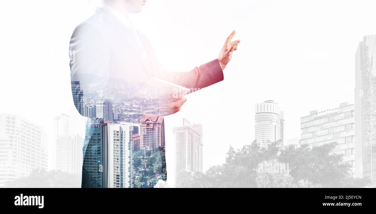 Standing entrepreneur in business suit Stock Photo - Alamy