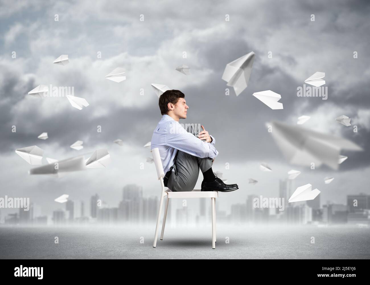 Man sitting on a paper plane hi-res stock photography and images - Alamy