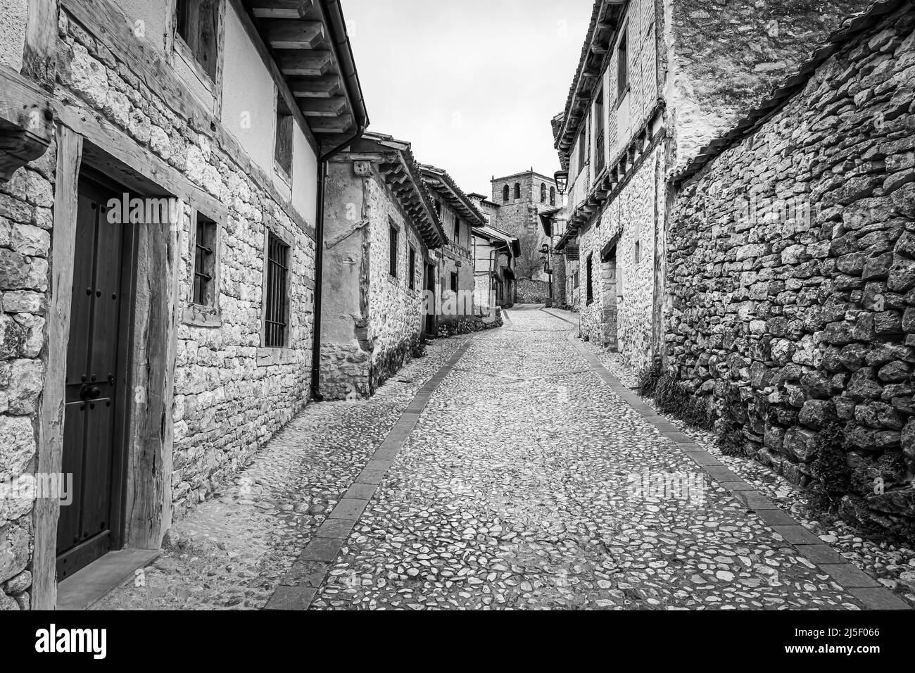 Medieval village alley made of stone, in black and white, Calatanazor ...