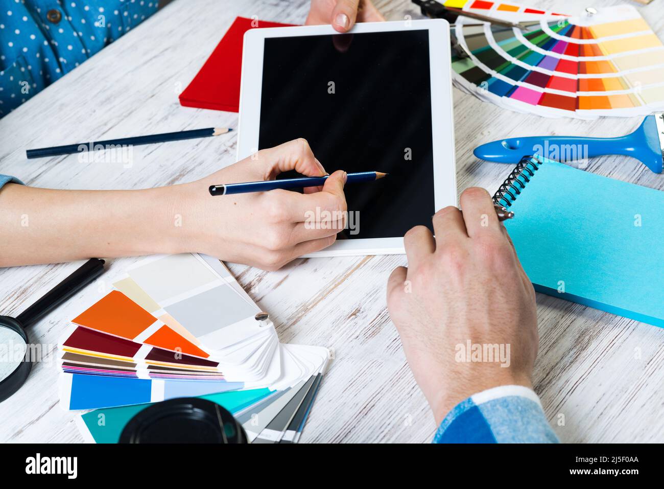 Web designer choosing colors from swatches Stock Photo - Alamy