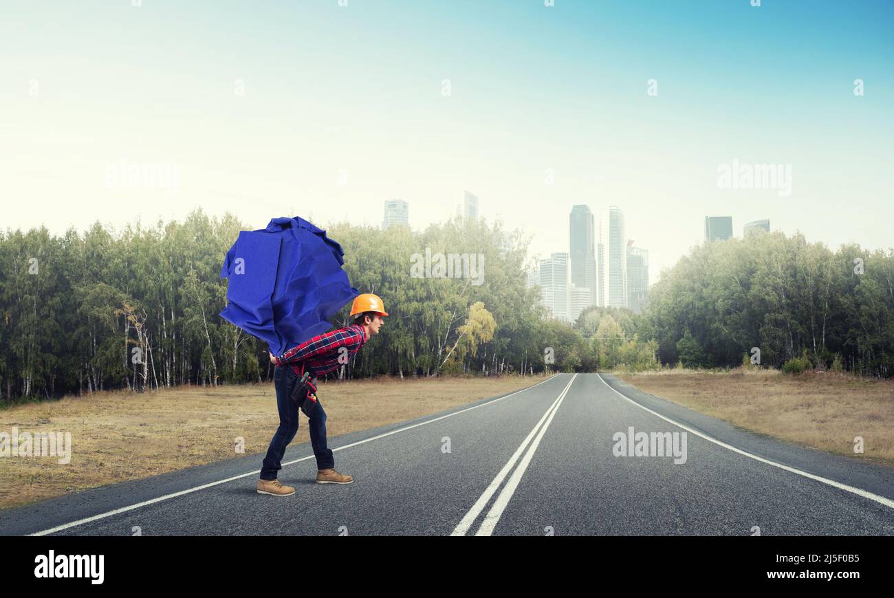 Engineer man carry load Stock Photo - Alamy
