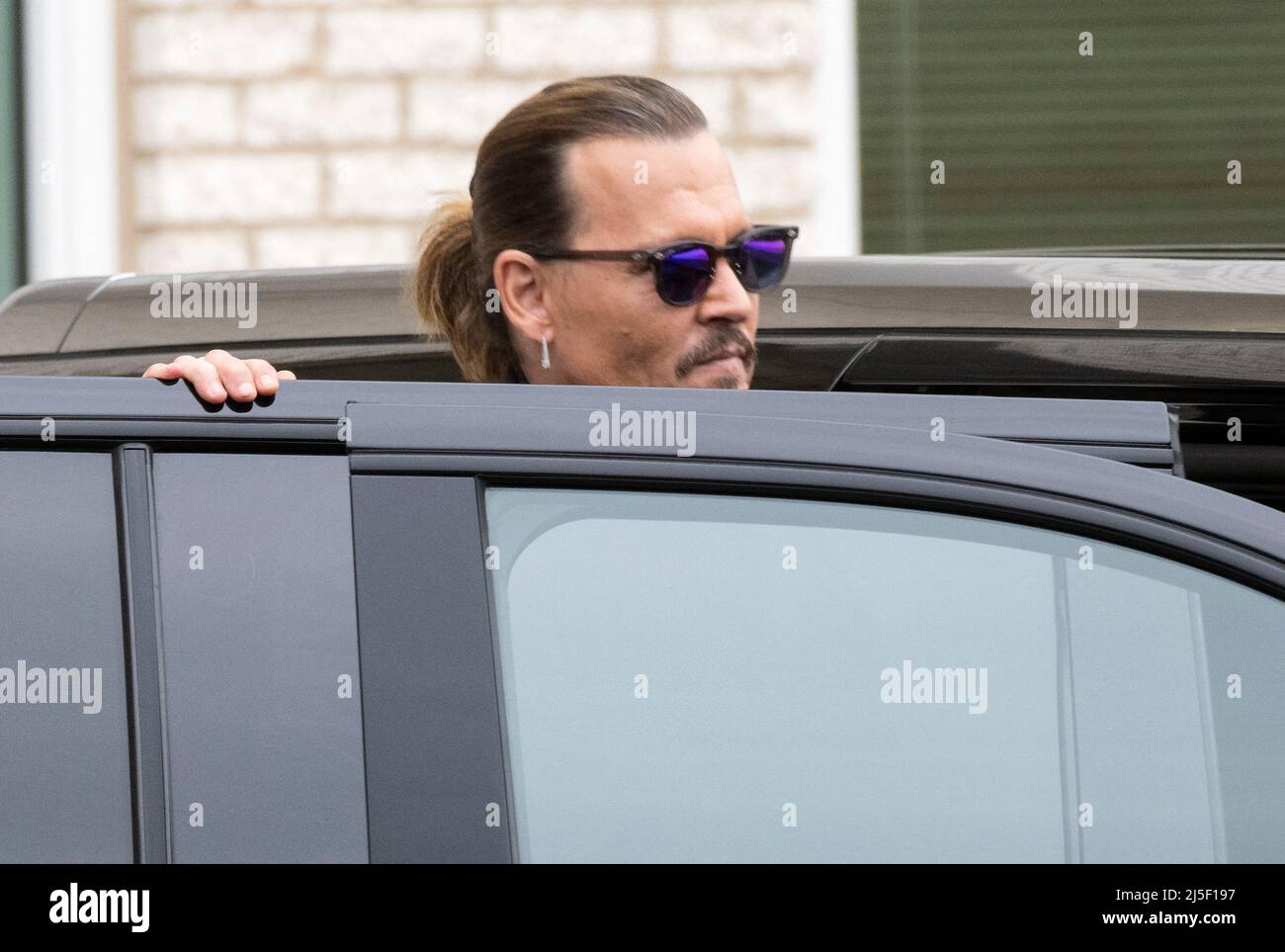 Johnny Depp enters his car as he departs following day 8 of his ...