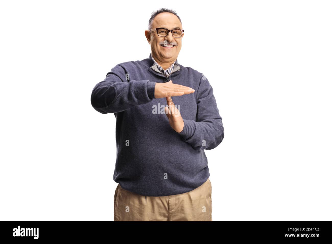 Smiling mature man gesturing time out isolated on white background ...