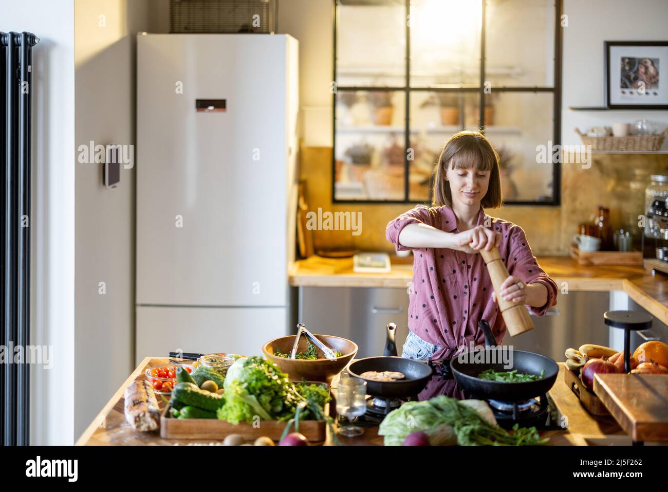 Woman cooking healthy and tasty food at home Stock Photo - Alamy