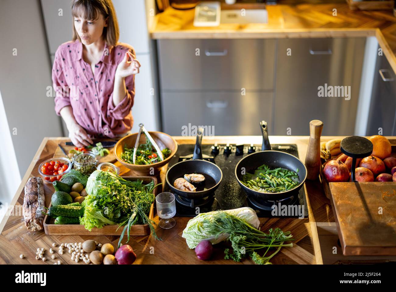 Woman cooking healthy and tasty food at home Stock Photo - Alamy