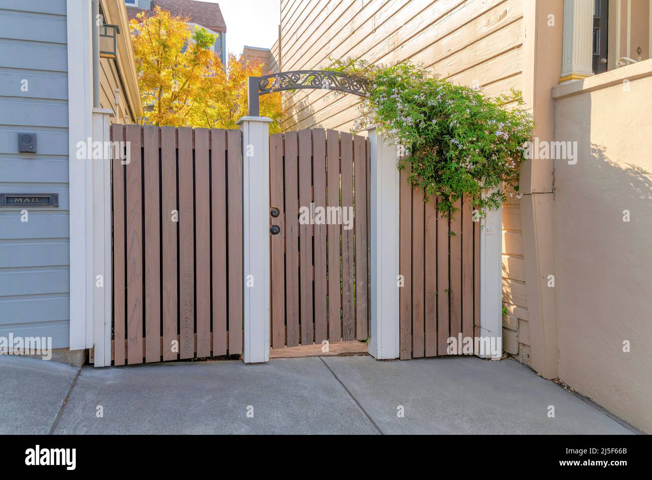 Wooden gate and fence with white concrete columns at San Francisco ...