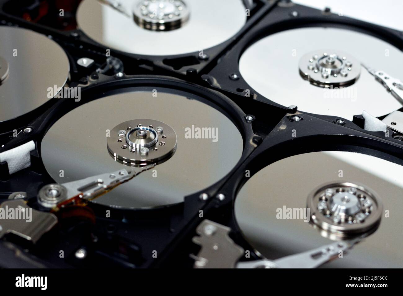 Computer hard disk drive storage memory, repair broken computer part, close up of open hard disc ...