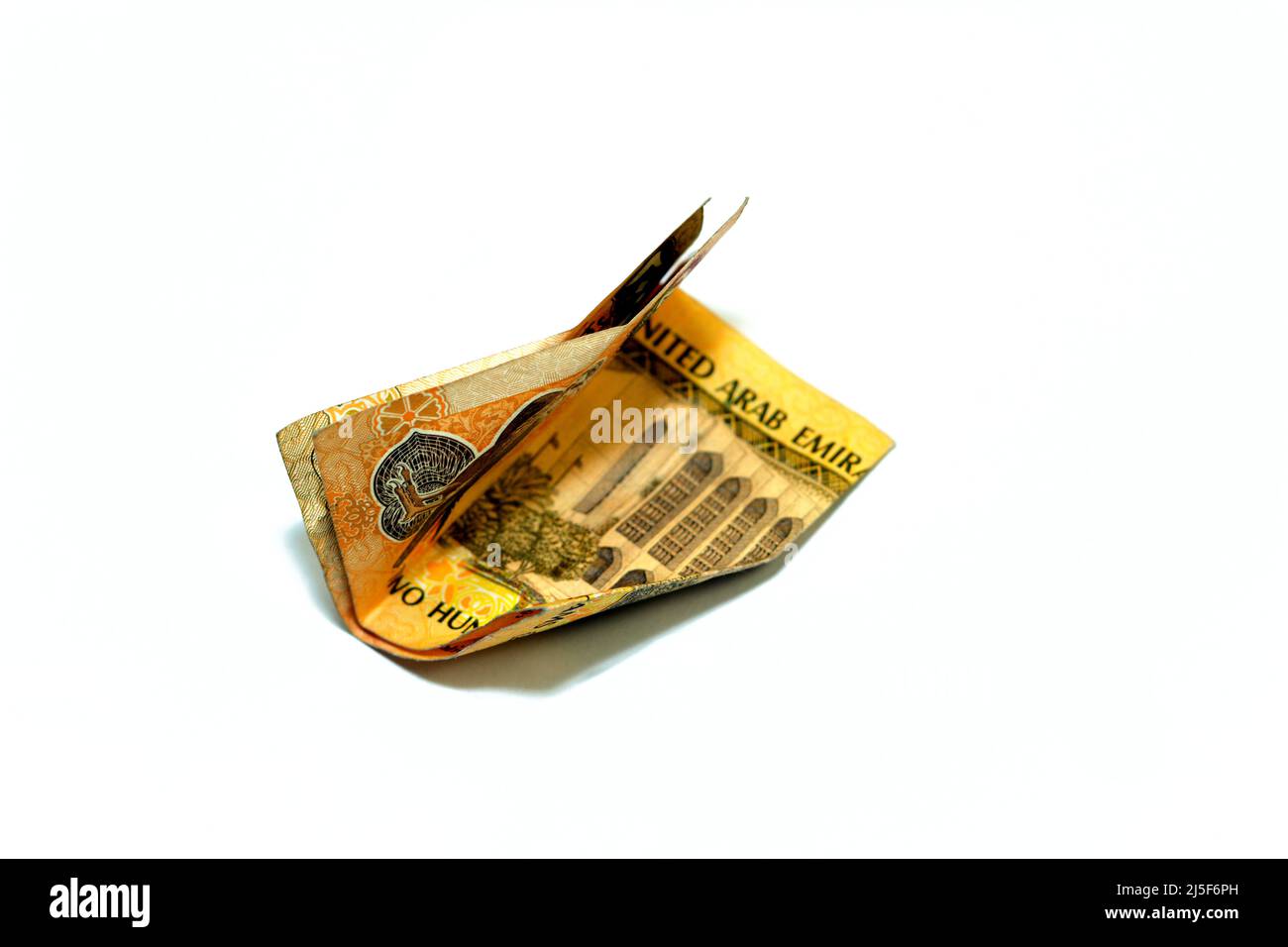 Selective focus of crumpled Emirates money of 200 AED two hundred ...
