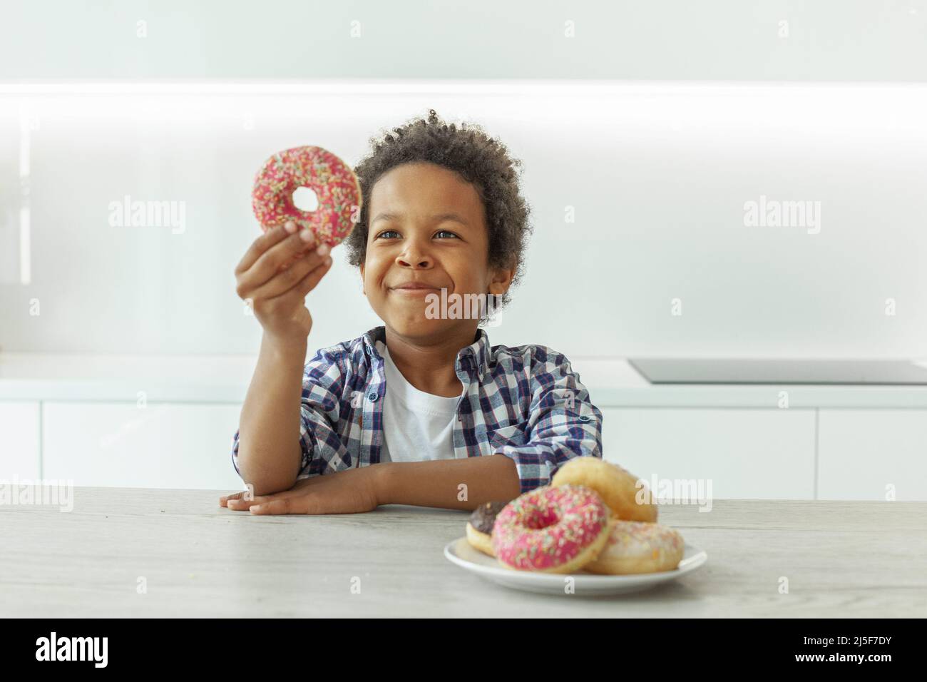 African american kid eating chocolate hi-res stock photography and ...