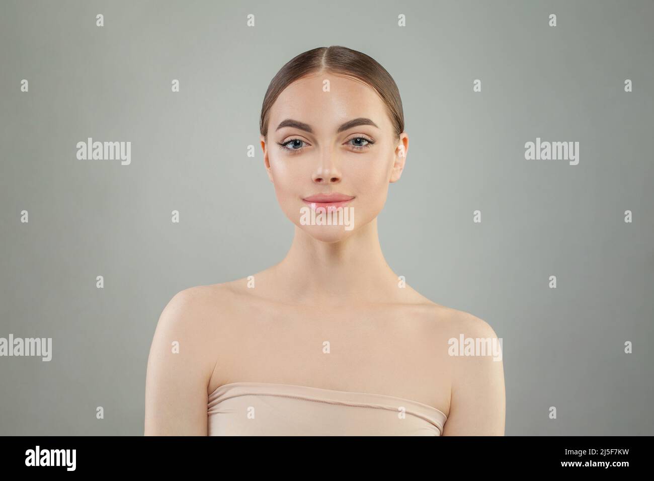 Beautiful face of young woman with clean skin close up. Beauty portrait ...