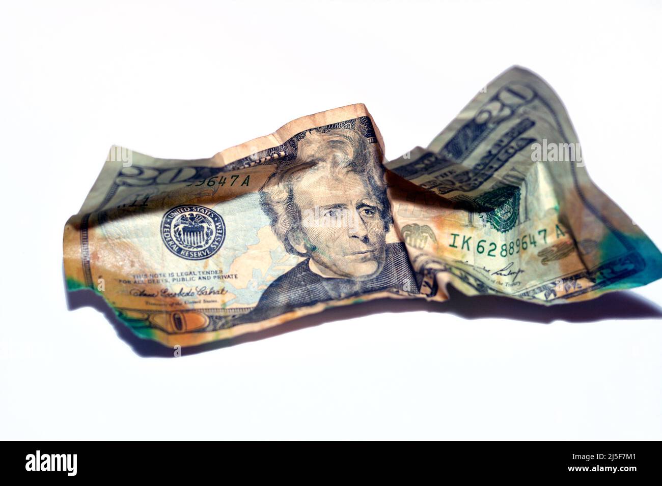 Selective focus of crumpled obverse American money of 20 $ twenty ...