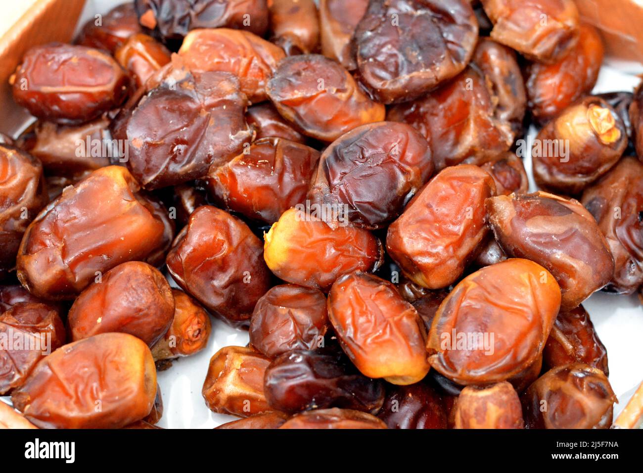 A background of wet dates fruits that is used in Ramadan month, the ...