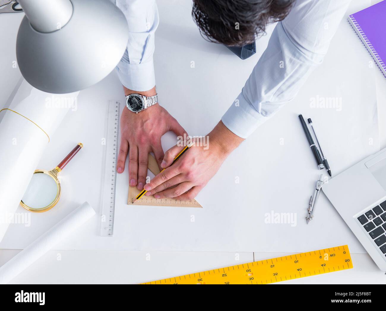 The engineer working on new project drawings Stock Photo - Alamy