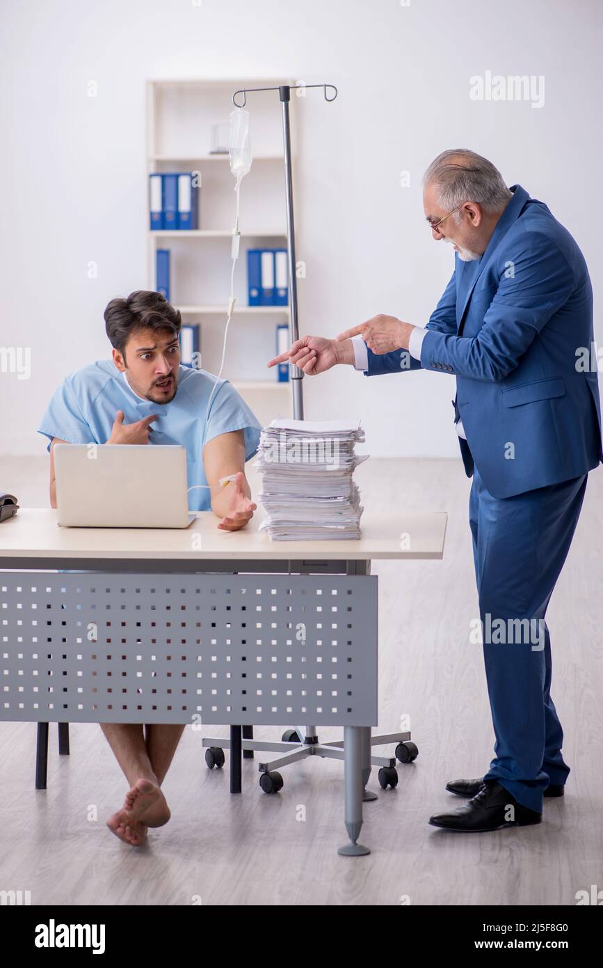 Young employee feeling bad at workplace Stock Photo - Alamy