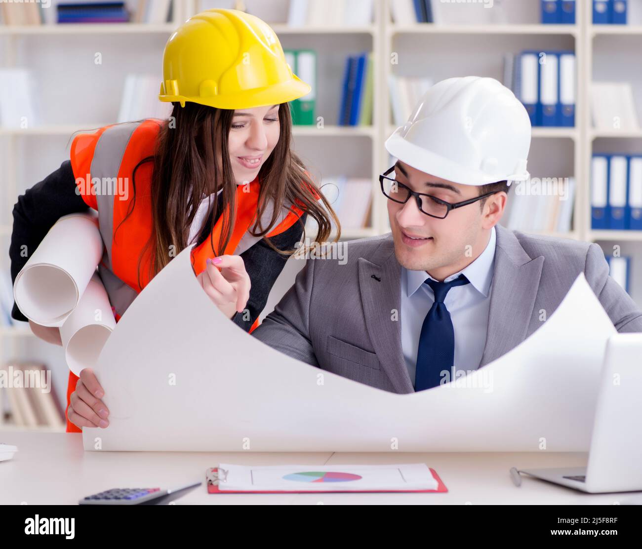 The construction foreman supervisor reviewing drawings Stock Photo - Alamy