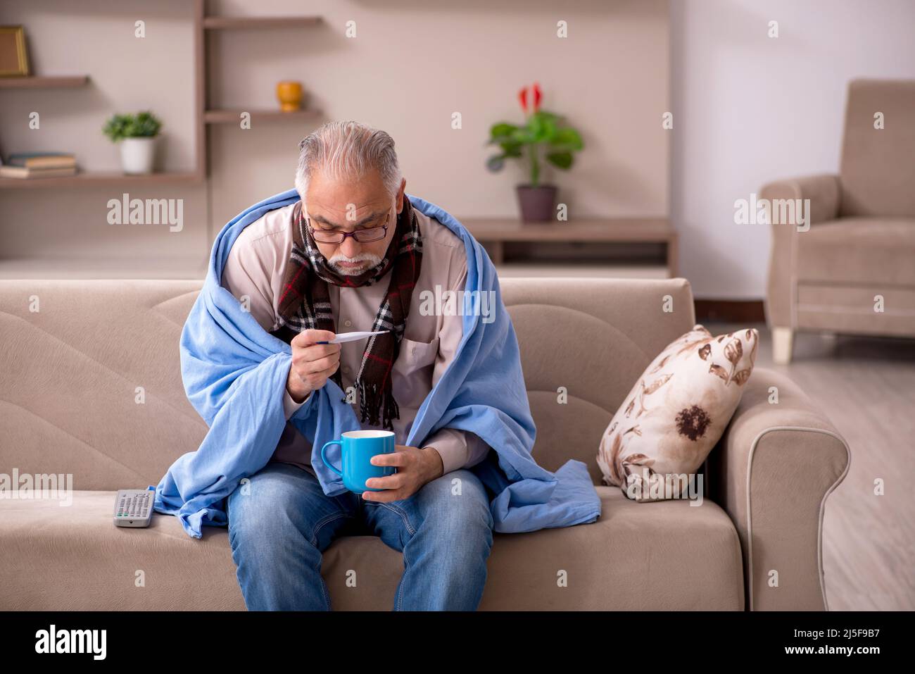 Old man pensioner suffering at home Stock Photo - Alamy