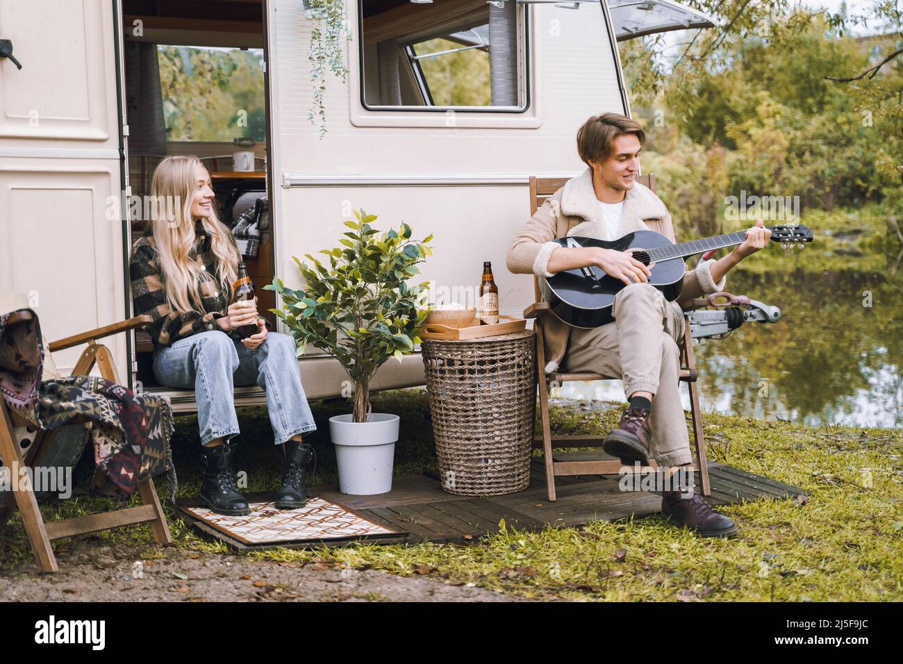 Young just married couple traveling in camper,house on wheels,trailer ...