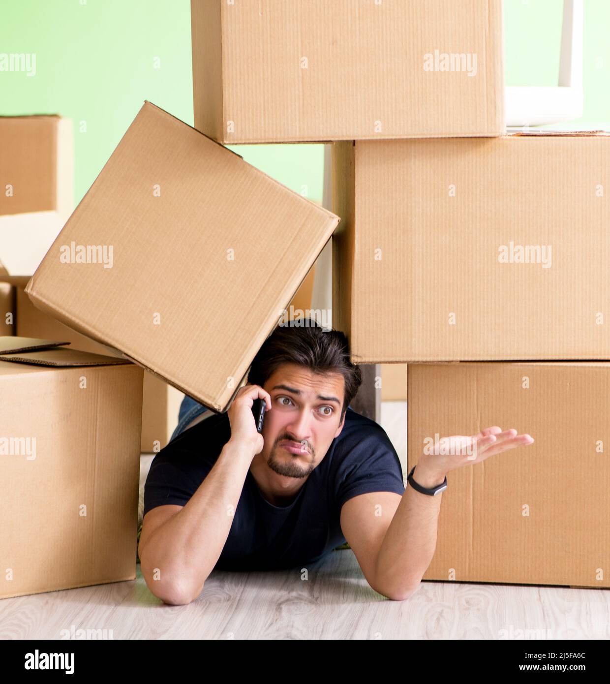 The man moving house with boxes Stock Photo - Alamy