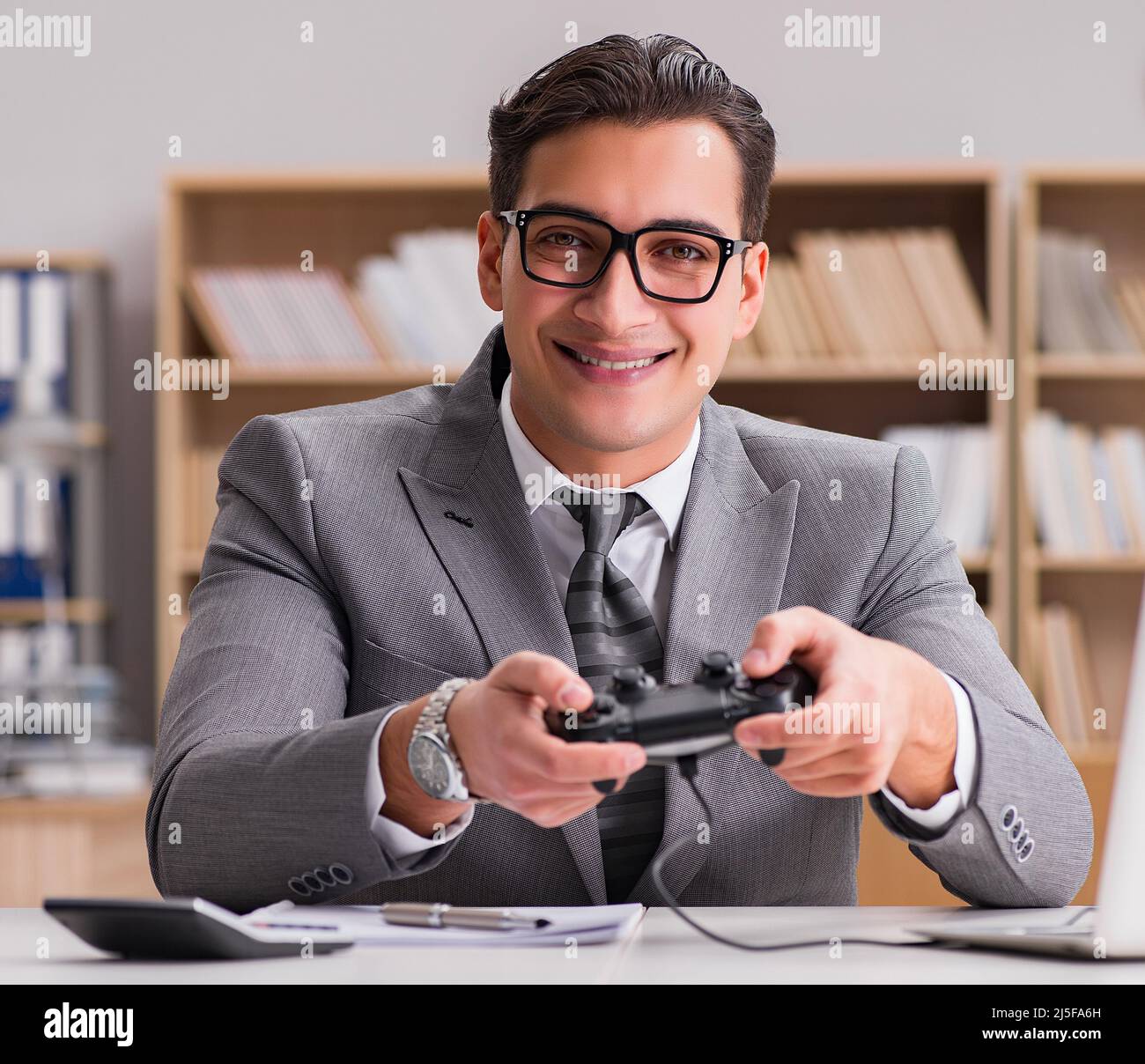 The businessman playing computer games at work office Stock Photo - Alamy