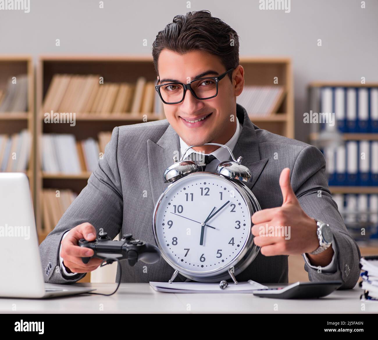 The businessman playing computer games at work office Stock Photo - Alamy