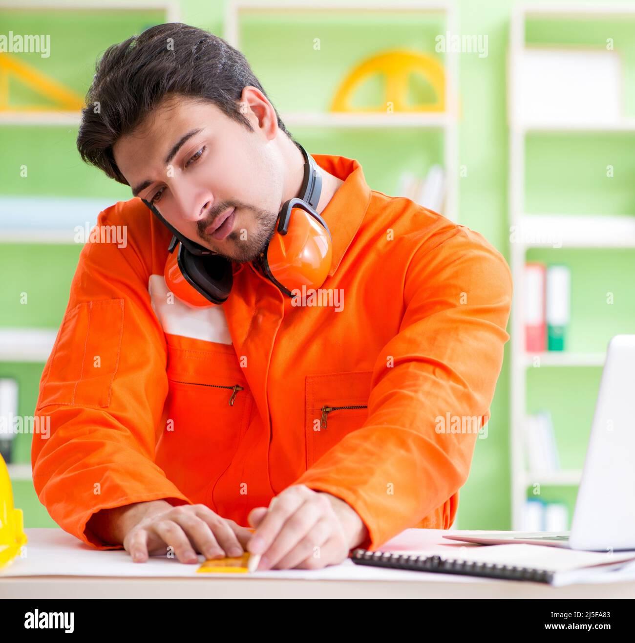 The construction supervisor planning new project in office Stock Photo ...
