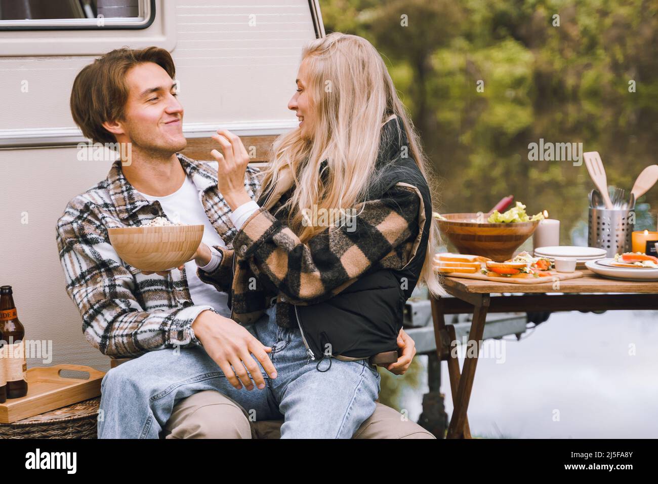 Young just married couple traveling in camper,house on wheels,trailer ...