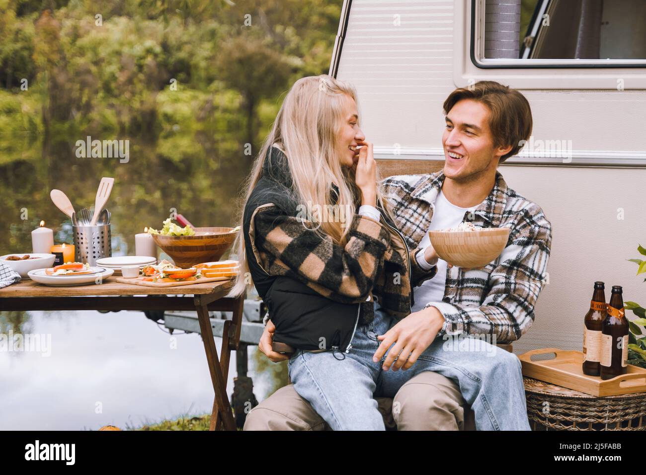 Young just married couple traveling in camper,house on wheels,trailer ...