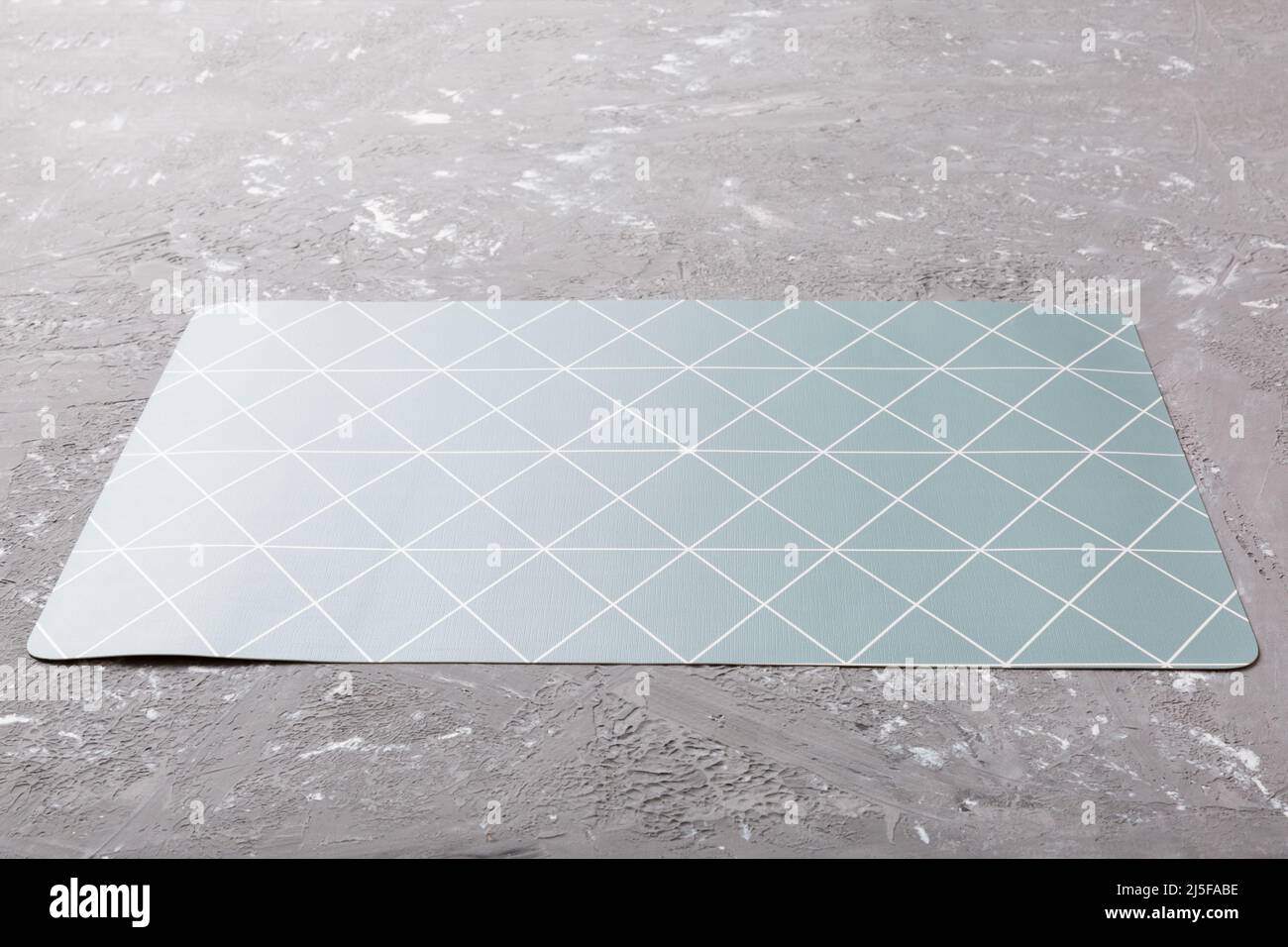 Perspective view of grey tablecloth for food on cement background ...