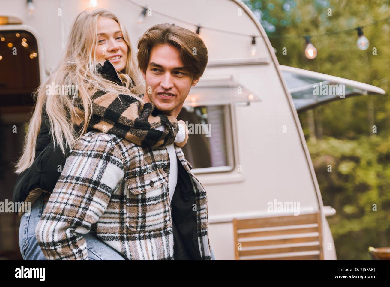 Young just married couple traveling in camper,house on wheels,trailer ...