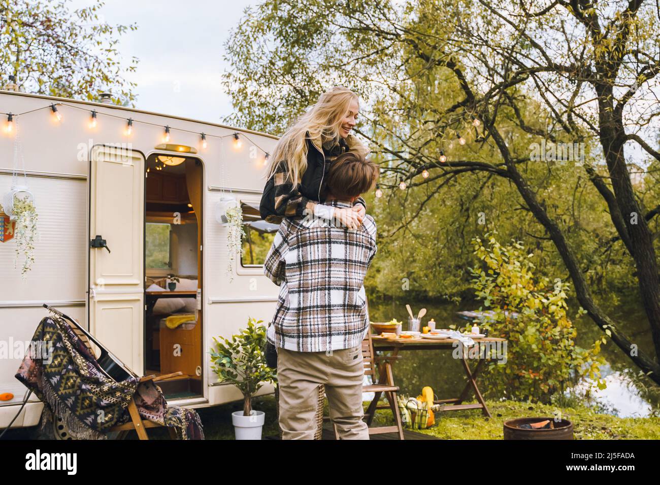Young just married couple traveling in camper,house on wheels,trailer ...