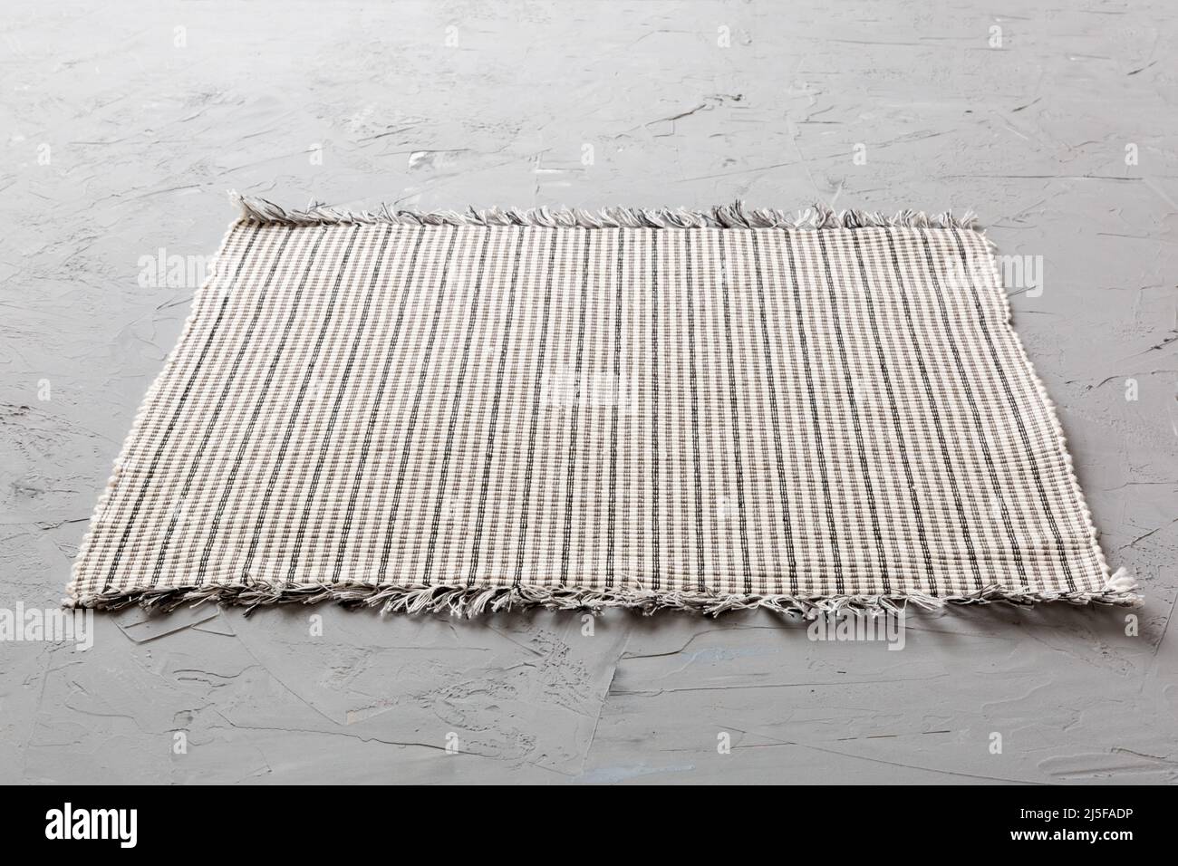 Perspective view of grey tablecloth for food on cement background ...