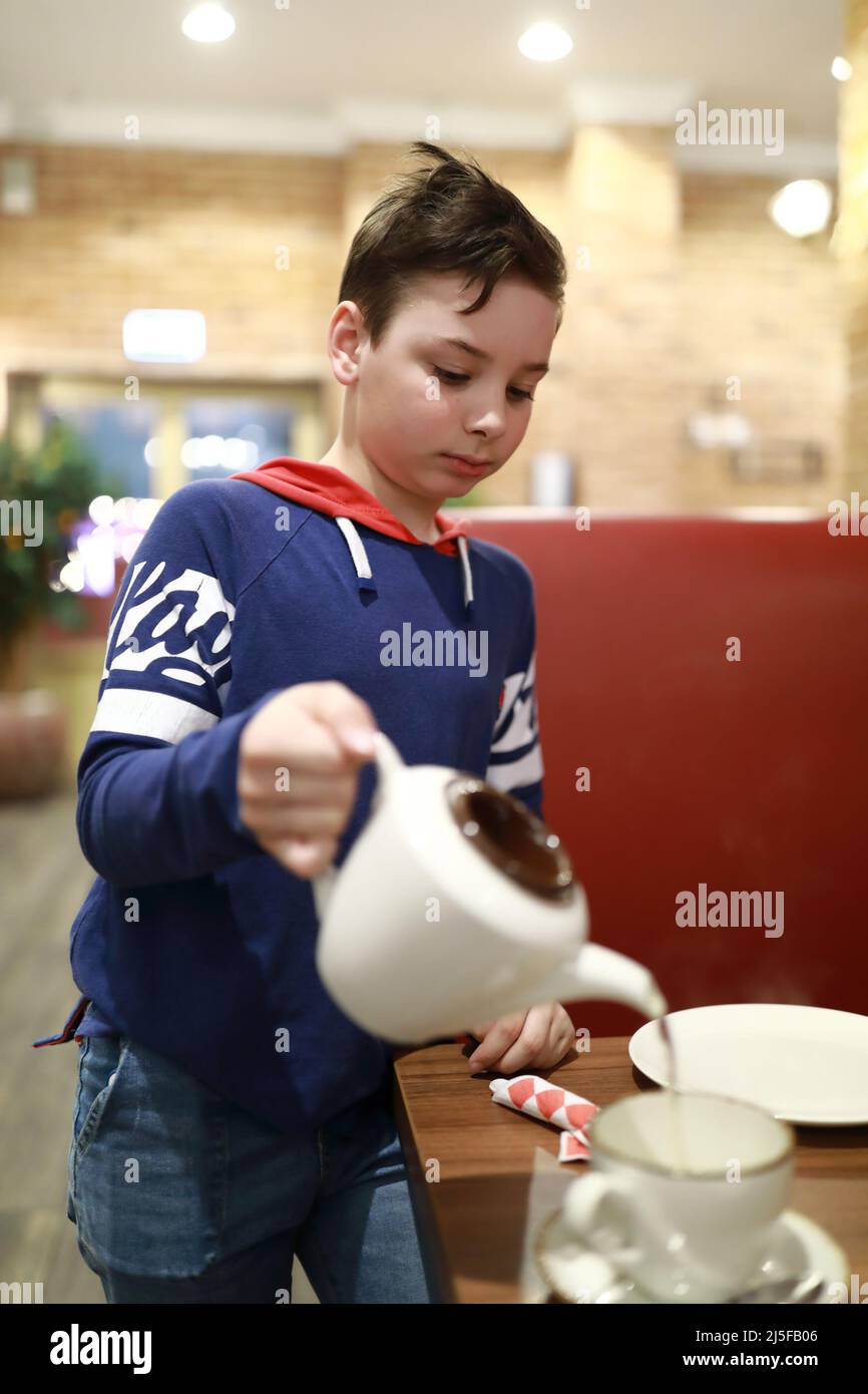 Boy table drinking tea hi-res stock photography and images - Alamy