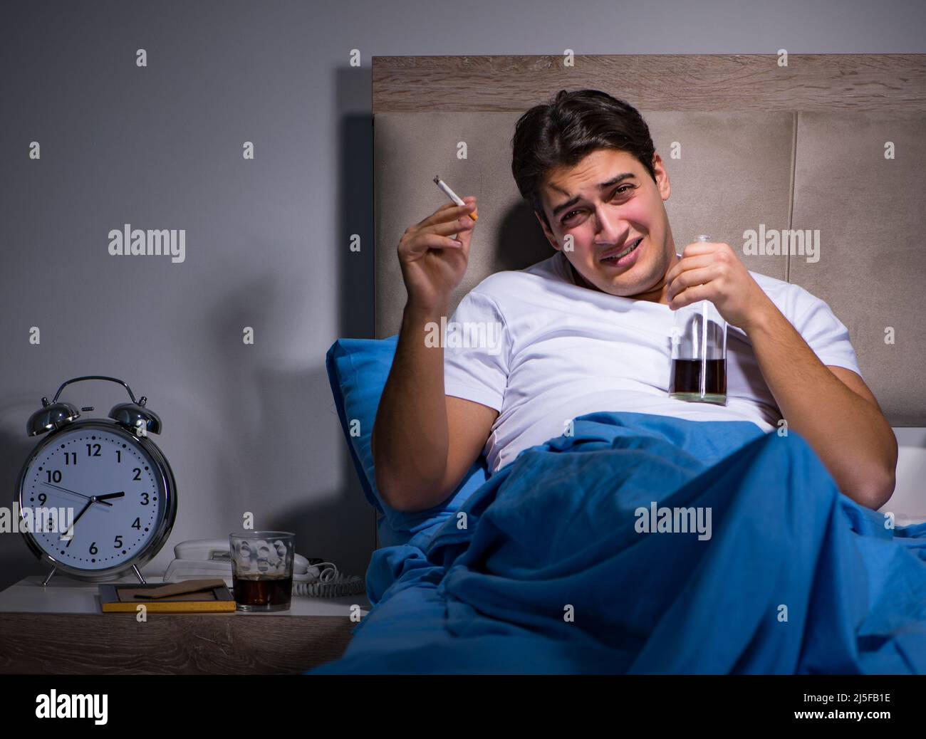 The desperate man divorced in bed Stock Photo - Alamy