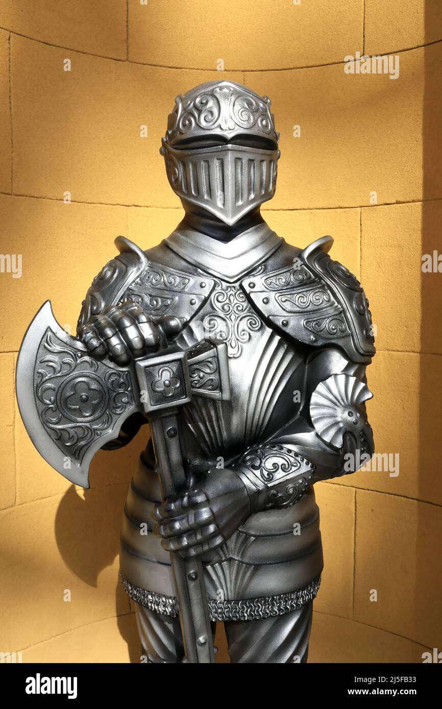 View if iron knight on background of wall Stock Photo - Alamy