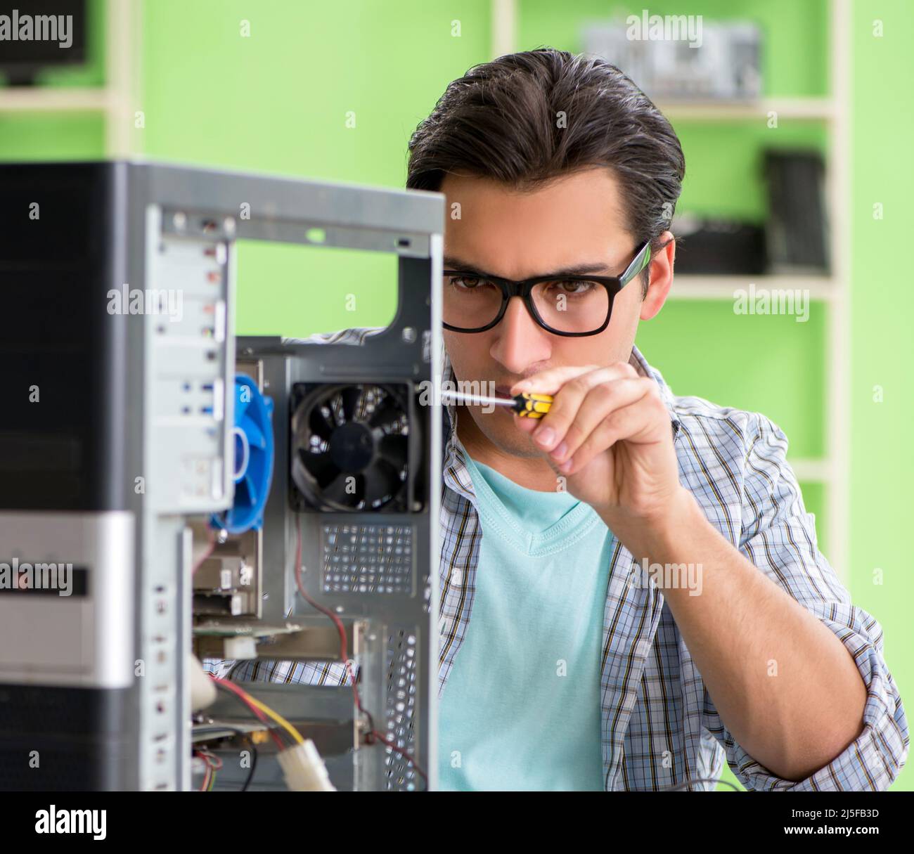 The computer engineer repairing broken desktop Stock Photo - Alamy