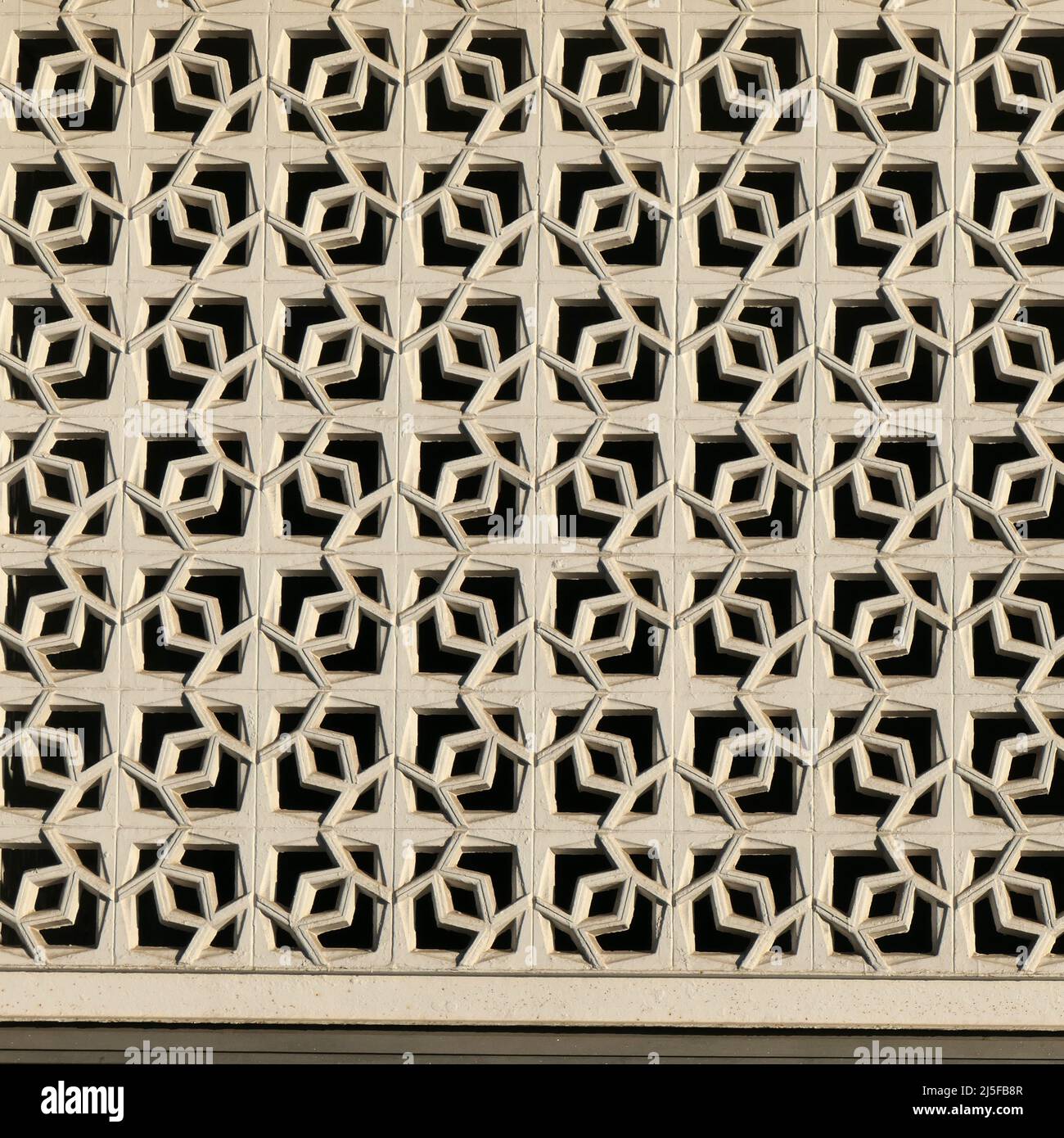 White painted brick ventilation pane in apartment block in Alora ...