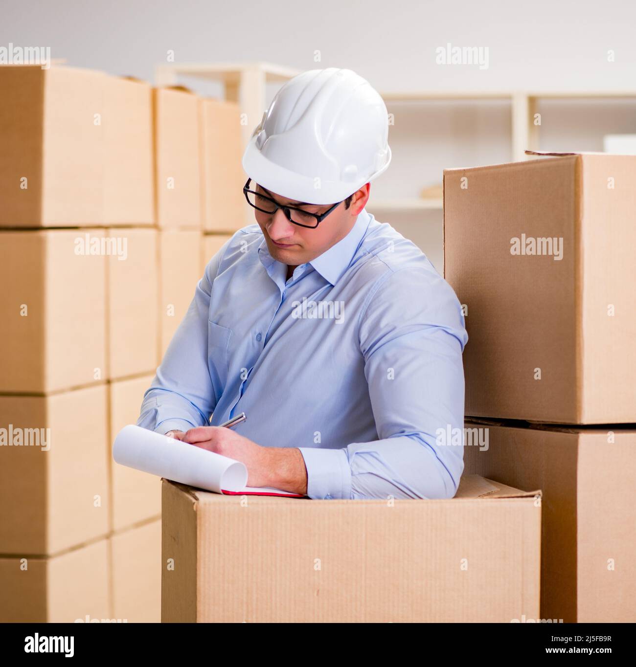 The man working in box delivery relocation service Stock Photo - Alamy
