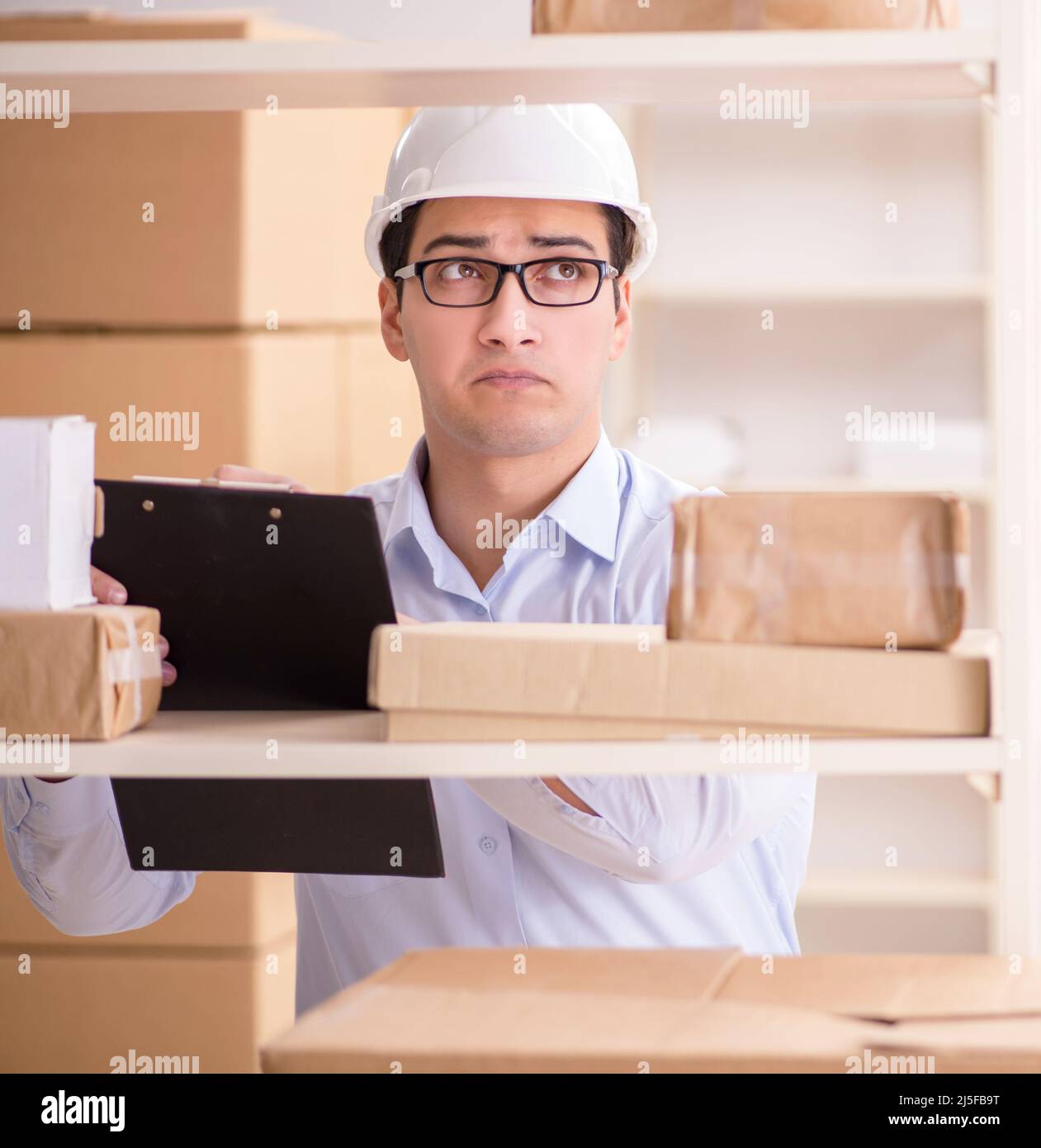 The man working in postal parcel delivery service office Stock Photo ...