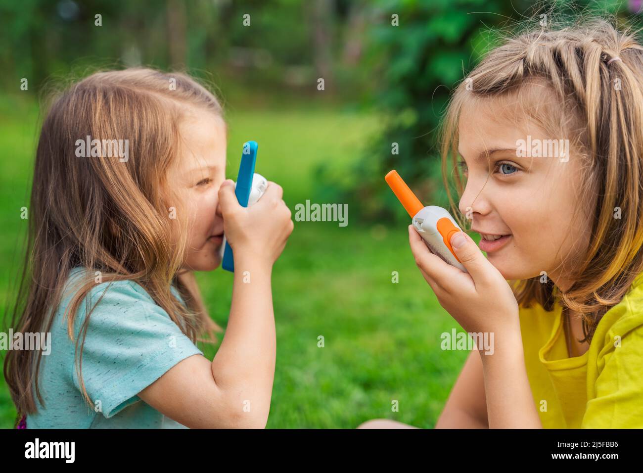 Small kids,girls play in walkie-talkie.Walkie Talkies with channels ...