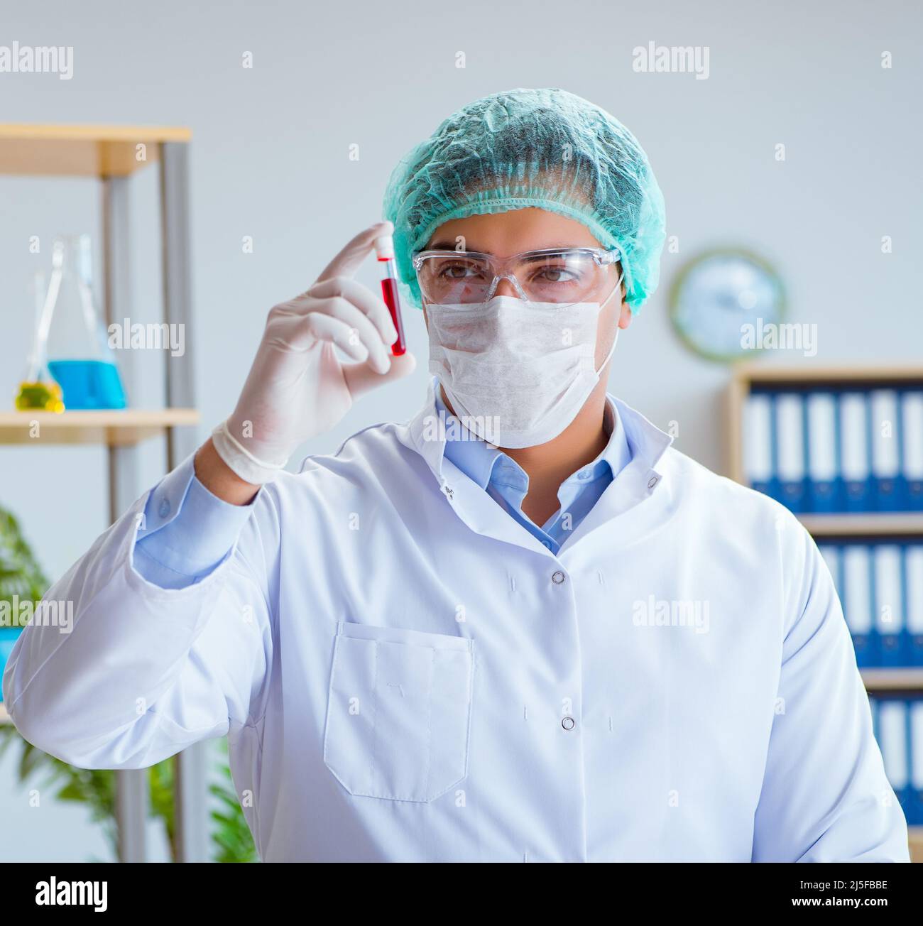 The young doctor working on blood test in lab hospital Stock Photo - Alamy