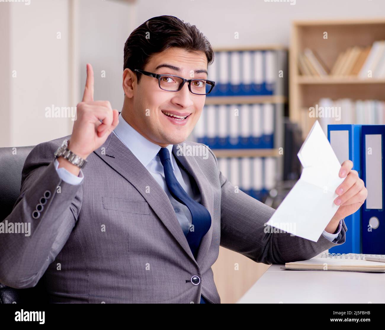 The businessman receiving letter envelope in office Stock Photo - Alamy