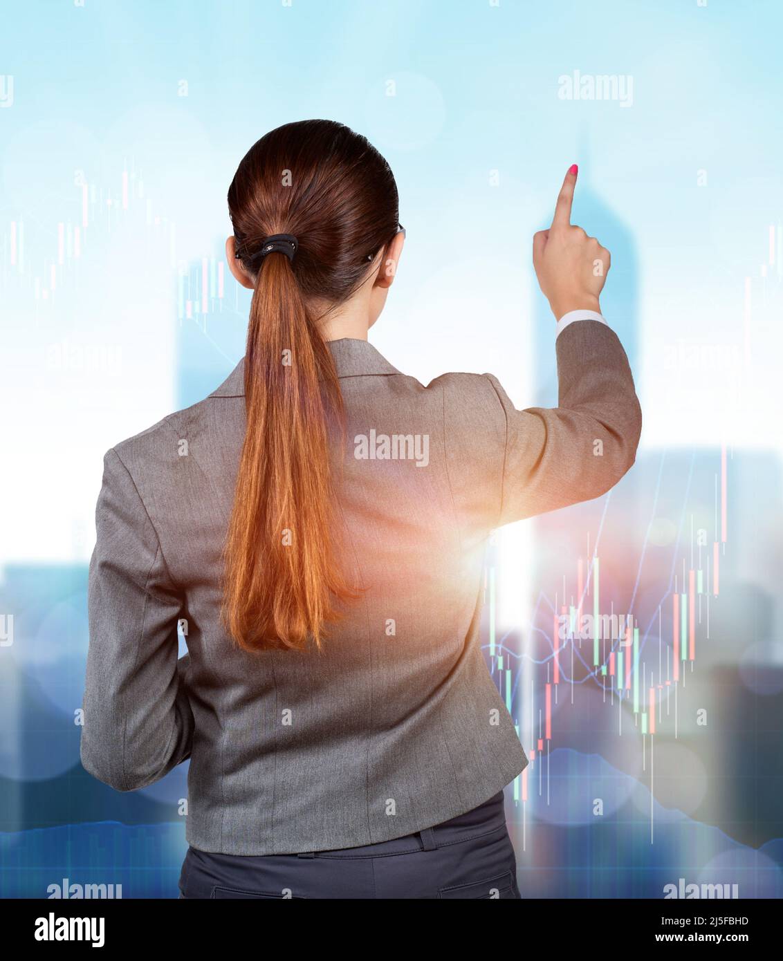 The businesswoman pressing buttons on line chart Stock Photo - Alamy