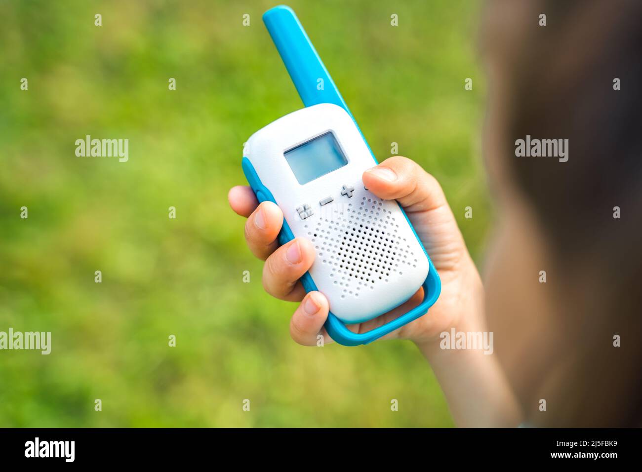 Small girl,kid play in walkie-talkie.Walkie Talkies with channels.Game ...