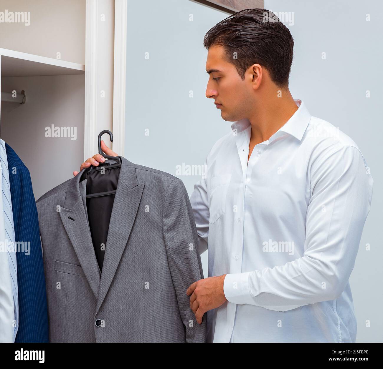 The businessman dressing up for work Stock Photo - Alamy