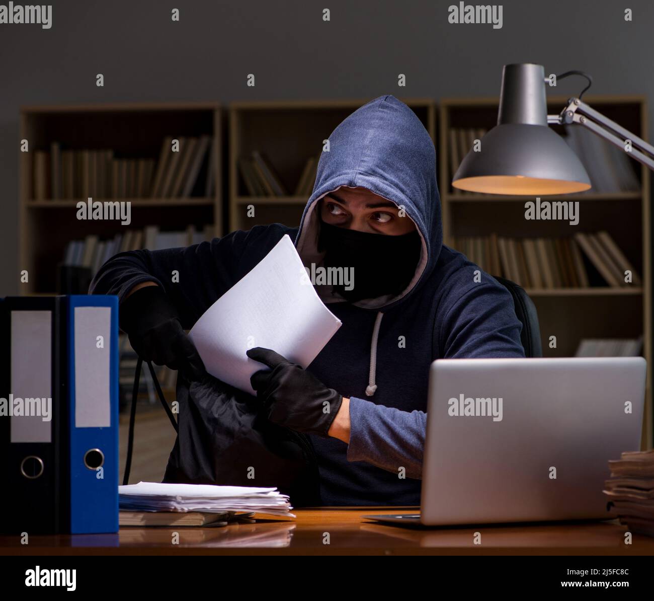 The hacker stealing personal data from home computer Stock Photo - Alamy