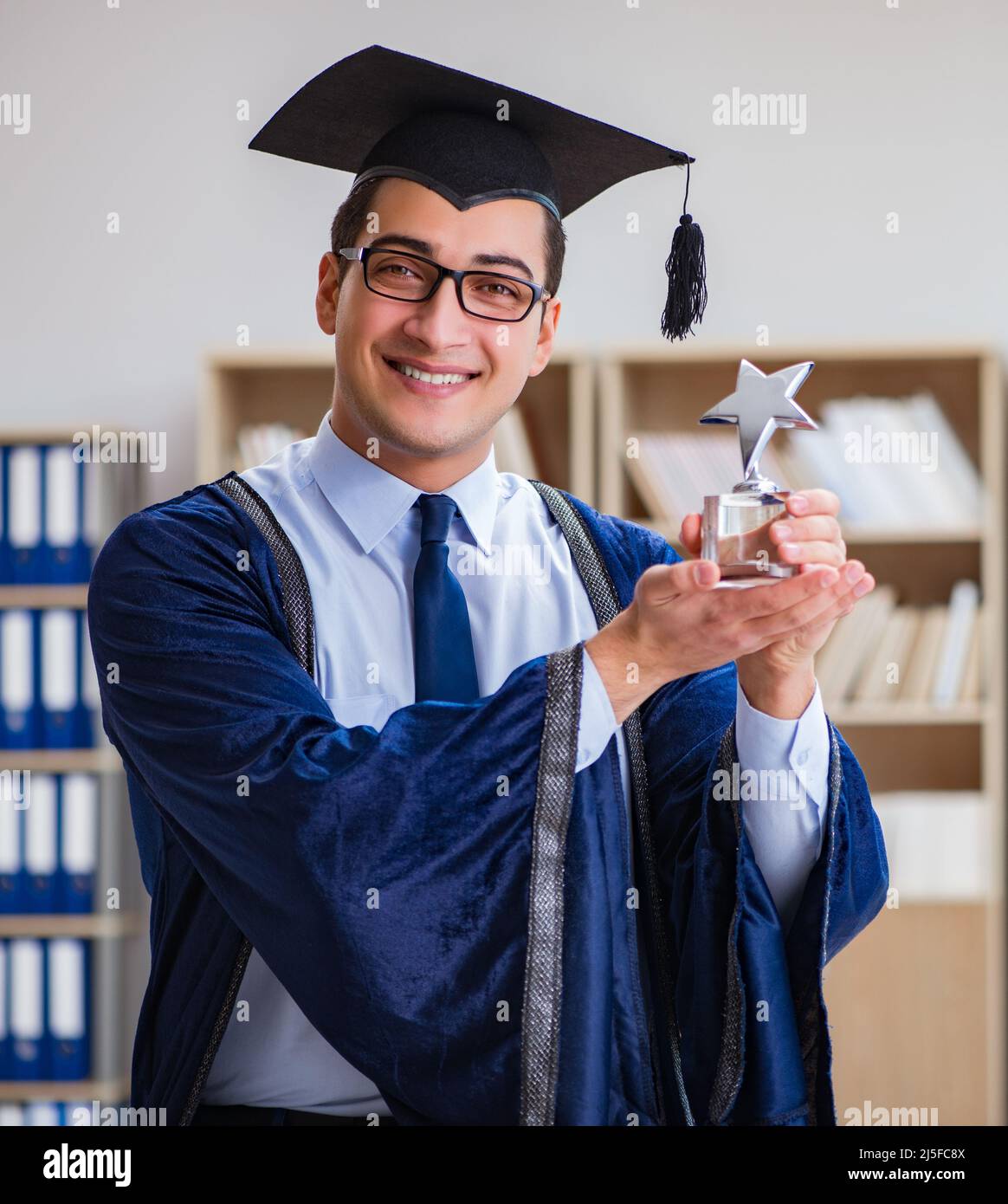The young man graduating from university Stock Photo - Alamy